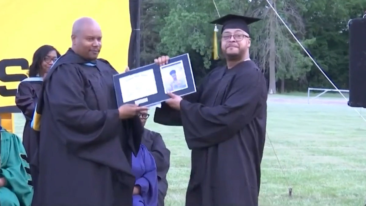 Father accepts late son's diploma during high school graduation ceremony
